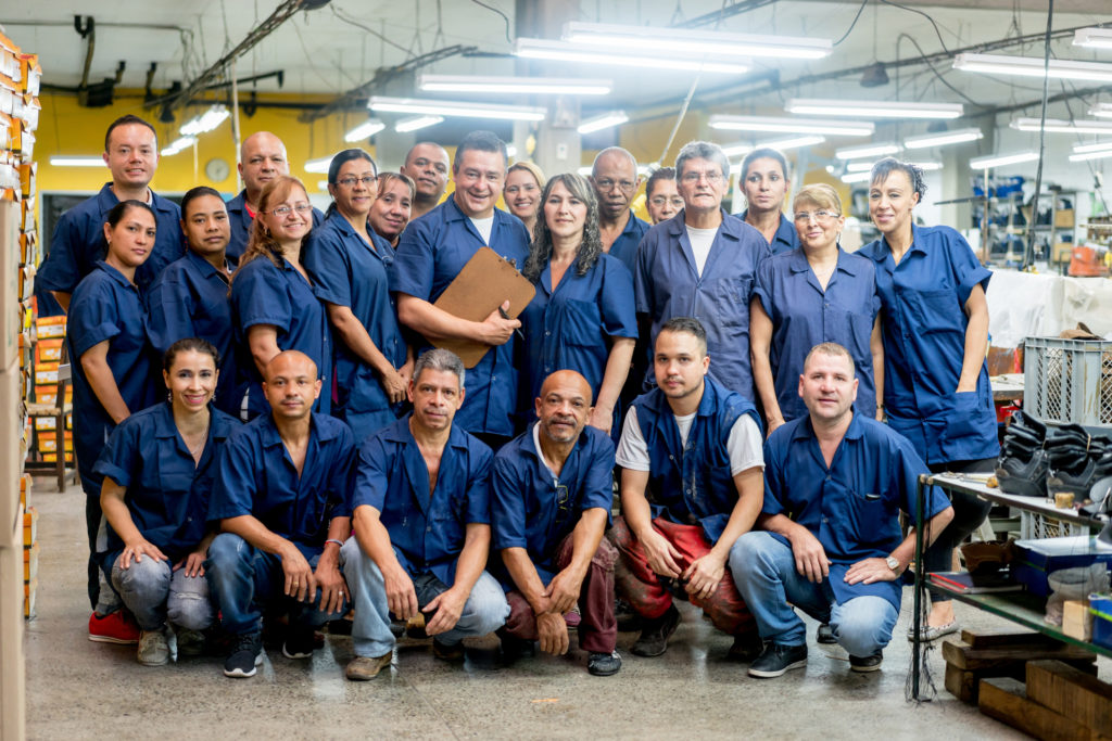 Group of workers at a factory - Midway Products Group, Inc.